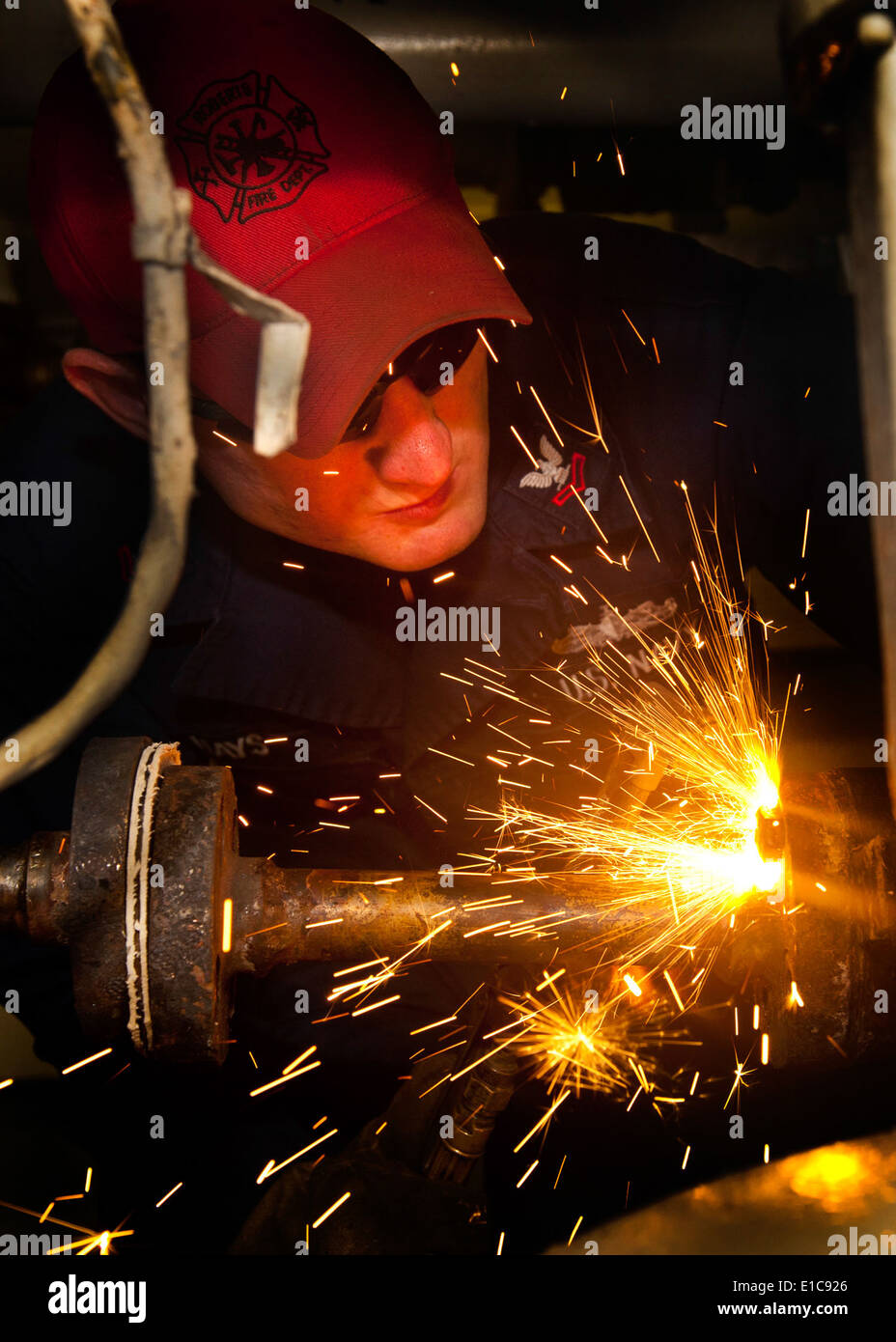 U.S. Navy Hull Maintenance Technician 2nd Class Joshua Hays replaces a ...