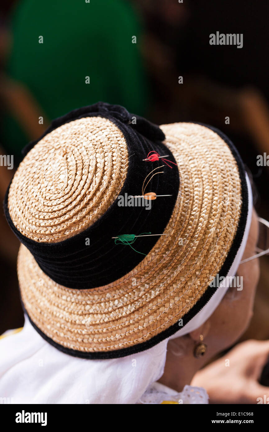 Straw hat decorated with needles and thread at the celebrations for ...
