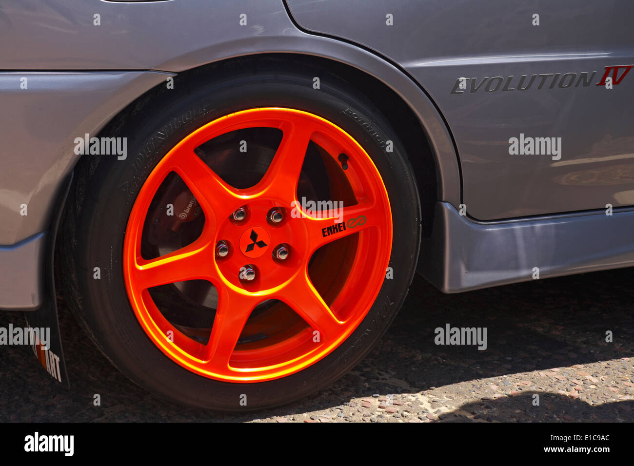 Dunlop Enkei Evolution IV - tyre on orange wheel on car Stock Photo - Alamy