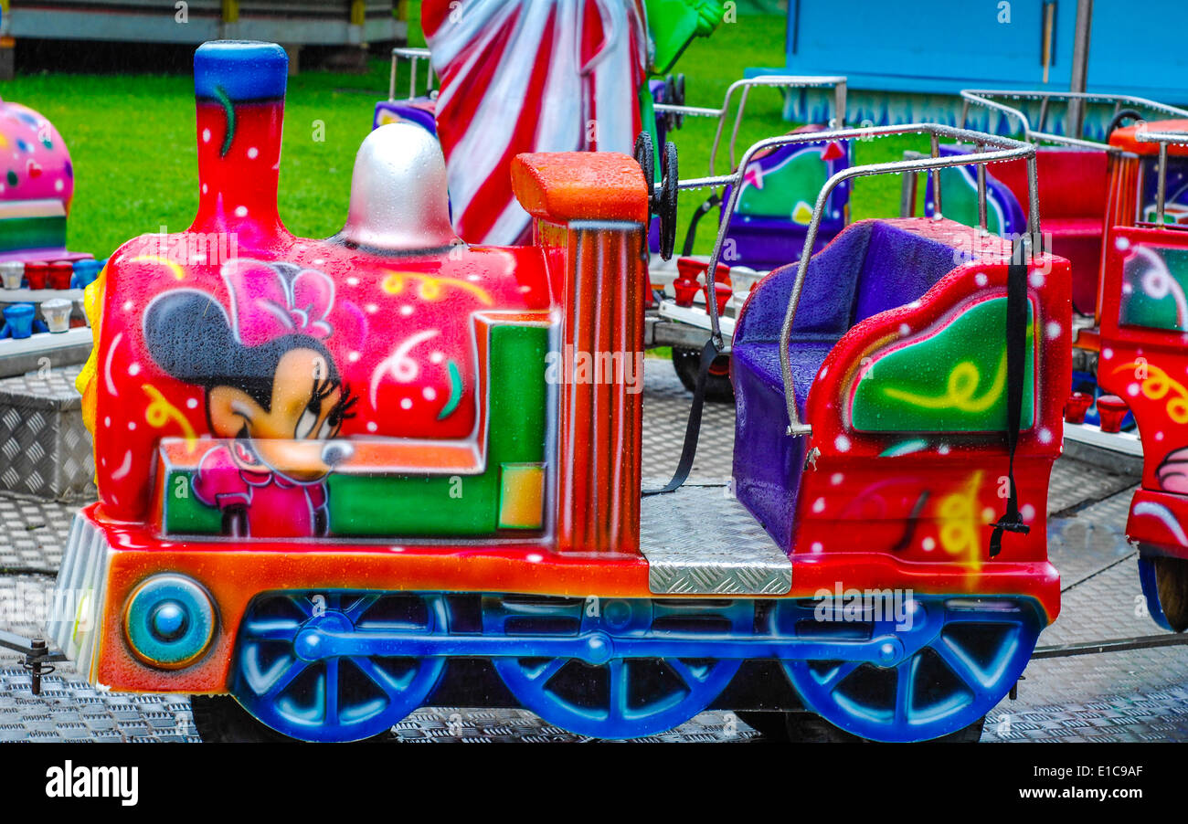 Toy train face fun fair ride Stock Photo - Alamy