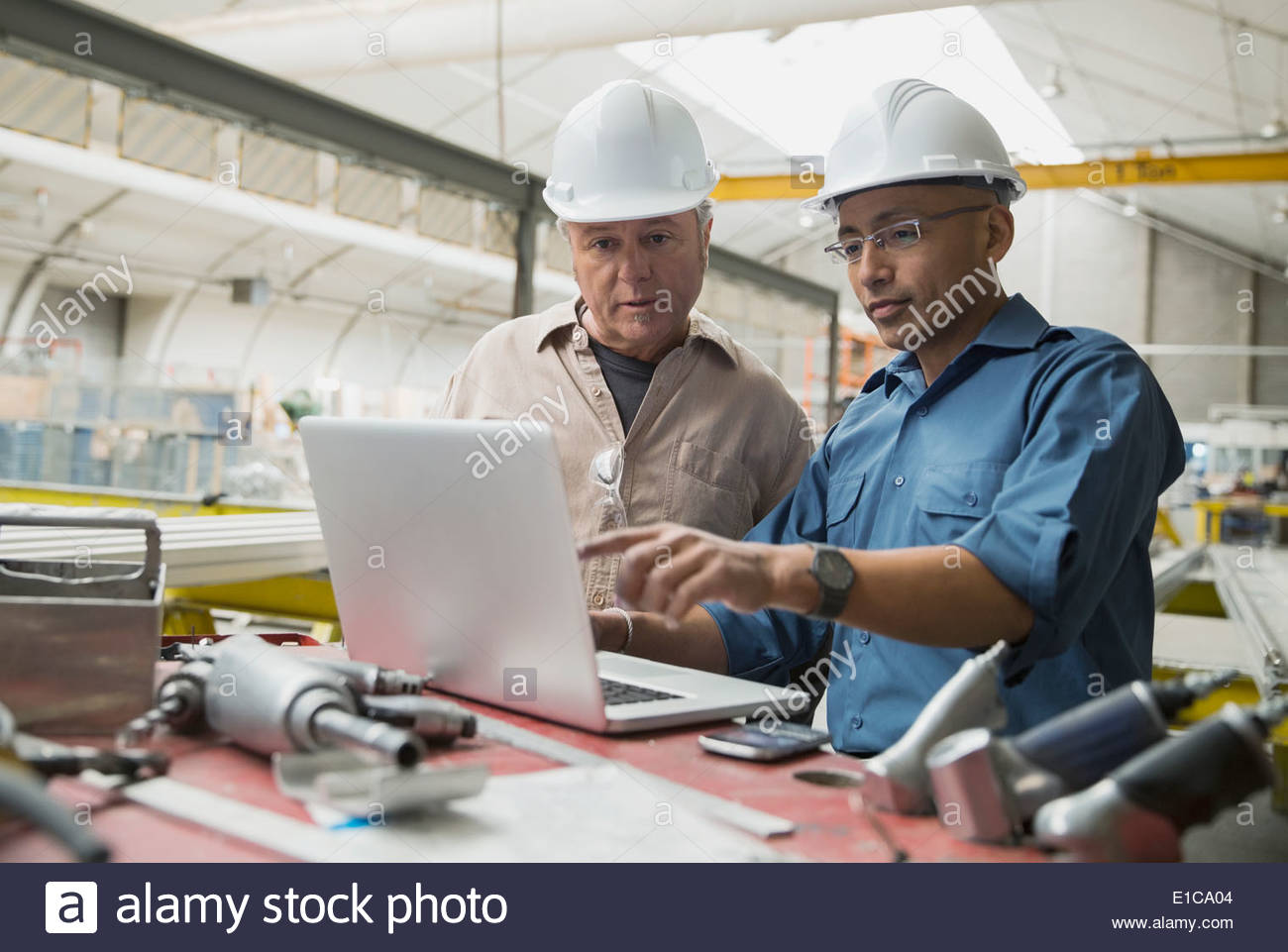 Manufacturing technology workers hi-res stock photography and images ...