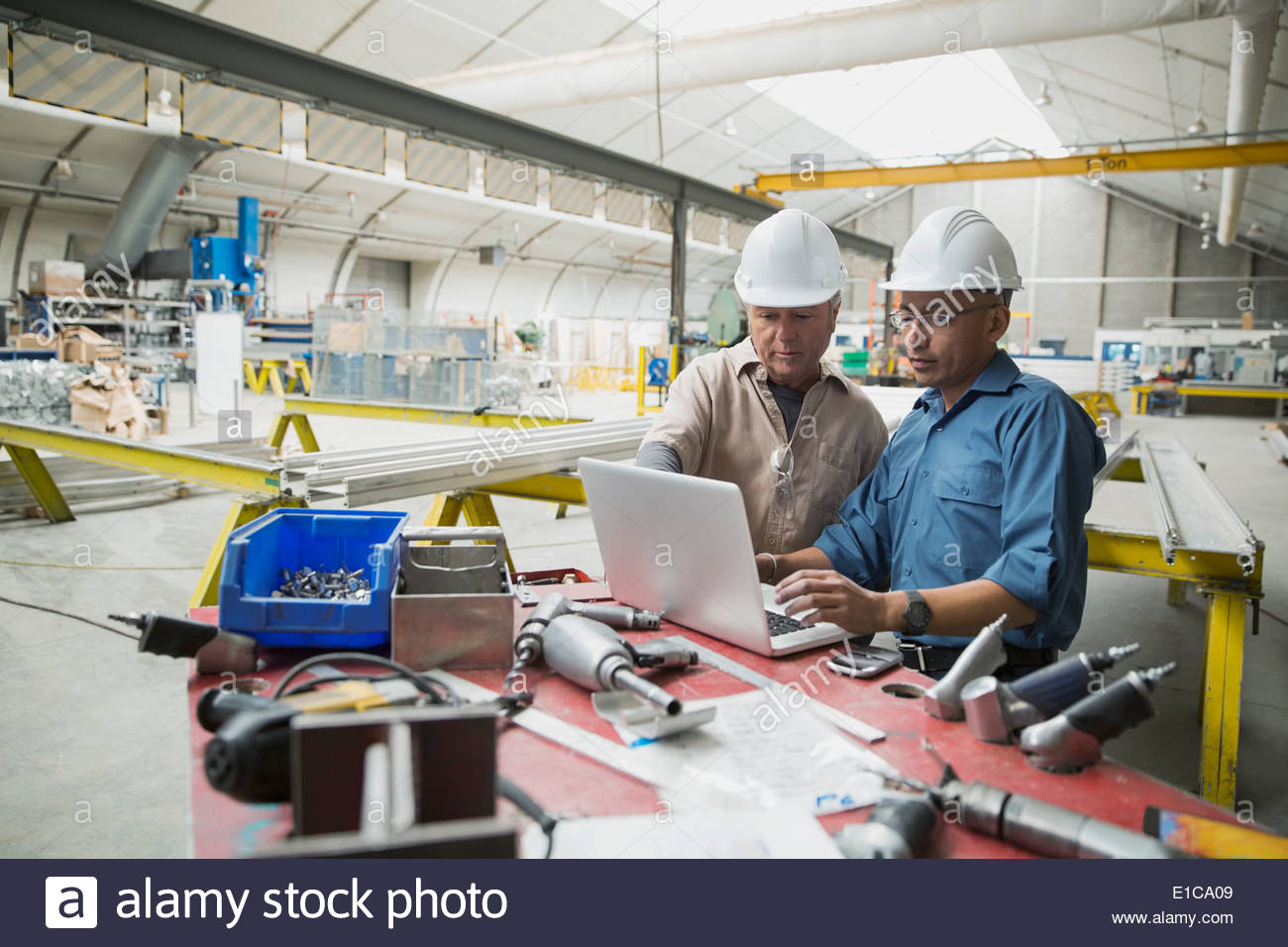 Manufacturing technology workers hi-res stock photography and images ...