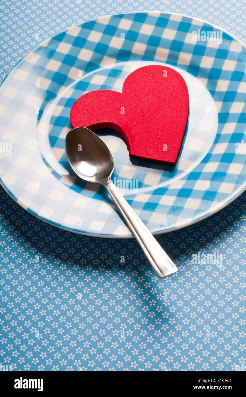 valentine heart shape partially eaten on a plate, hungry for love ...