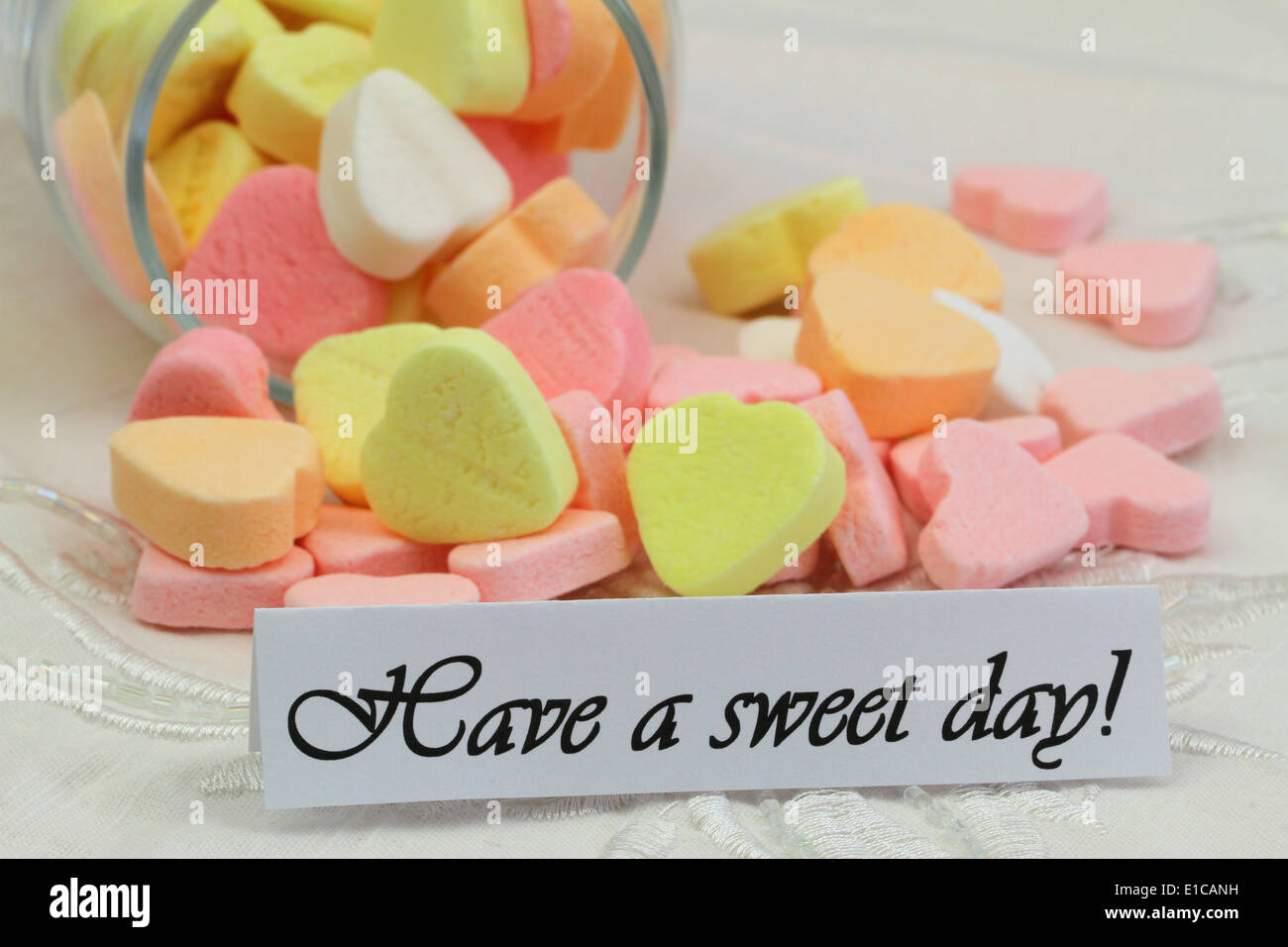 Have a sweet day card with colorful sugar hearts Stock Photo - Alamy