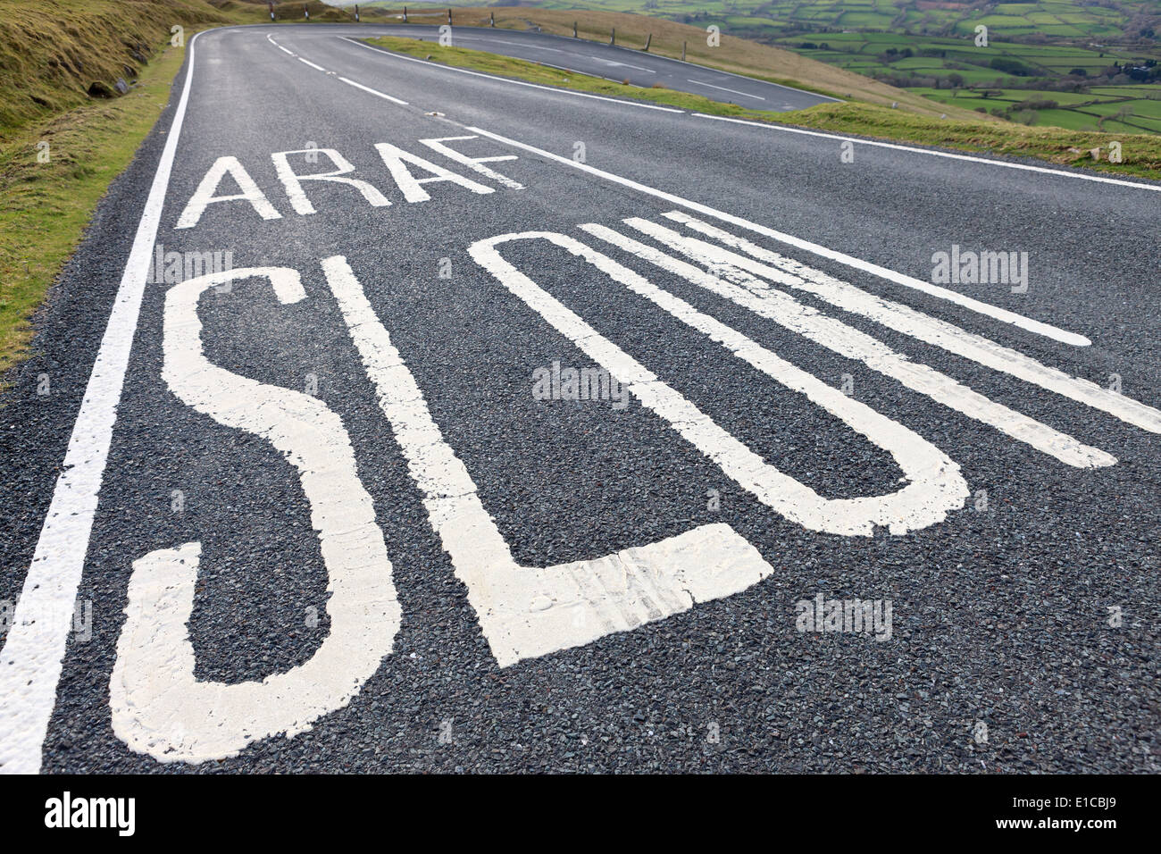 Slow road markings Stock Photo - Alamy