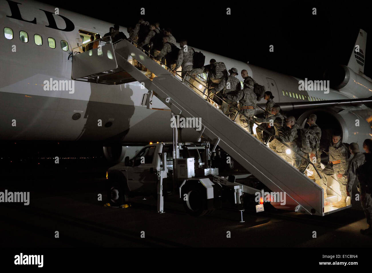 U.S. Airmen with the 28th Bomb Wing board an aircraft at Ellsworth Air ...