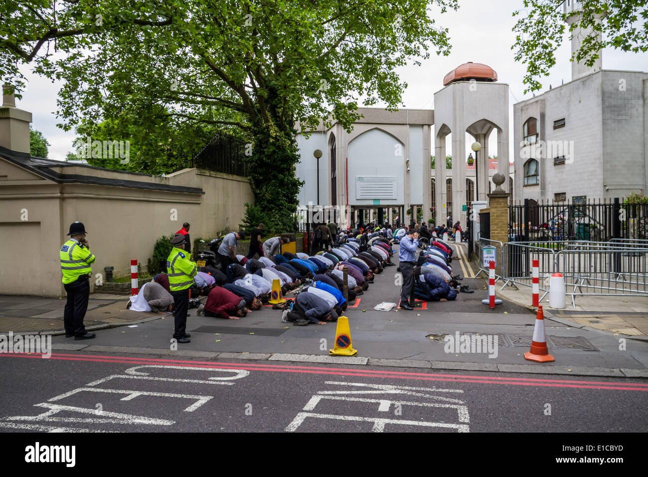 London, UK. 30th May 2014. Muslims attend Friday prayers at the London ...