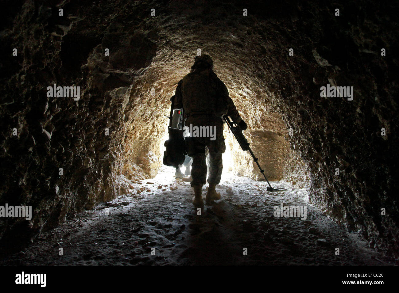 U.S. Army Spc. Jonathan Araiza uses a mine detector to search for ...