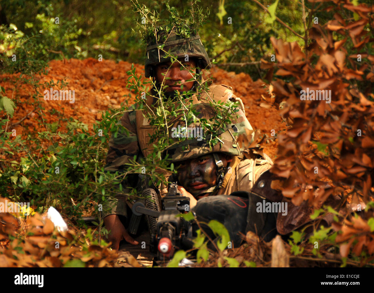 U.S. Navy Seabees from Naval Mobile Construction Battalion 133 scan the ...