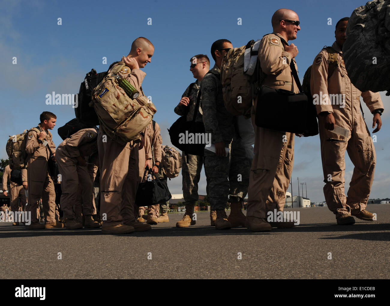 U.S. Airmen prepare to board a Boeing 757 aircraft on the flight line ...