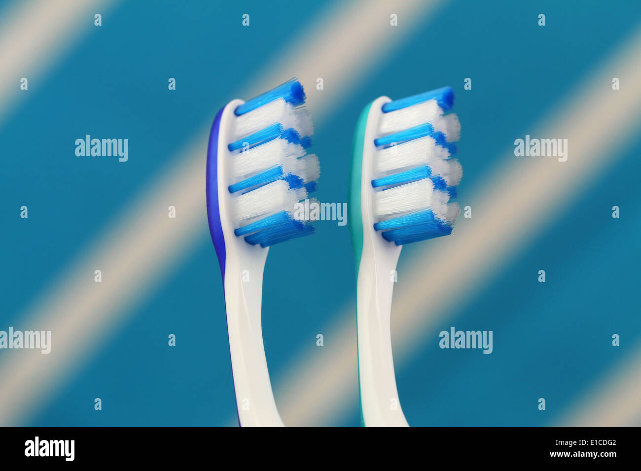 Blue and green toothbrushes Stock Photo - Alamy