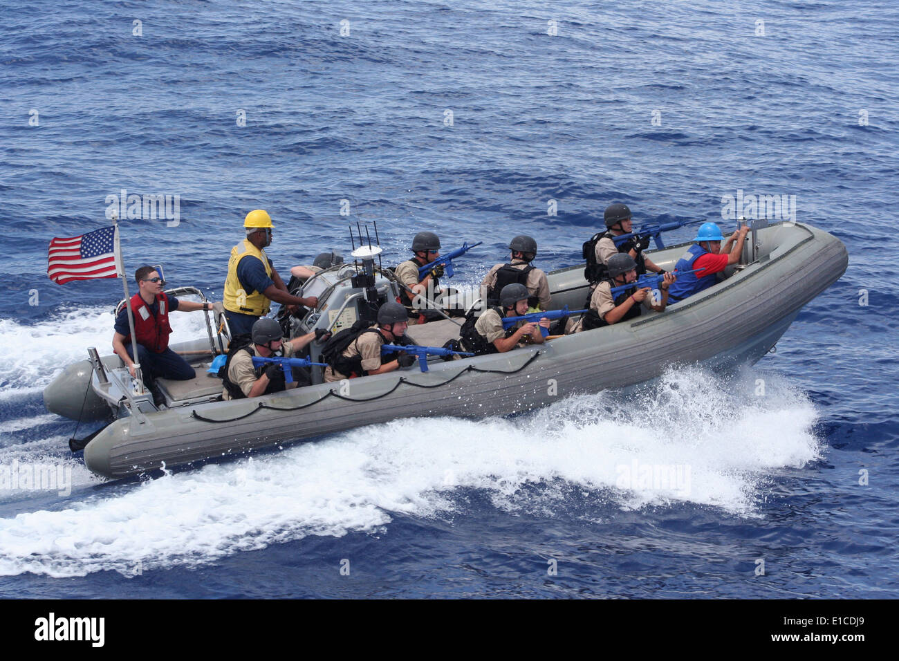 A U.S. Navy boarding team from the guided-missile frigate USS Doyle ...