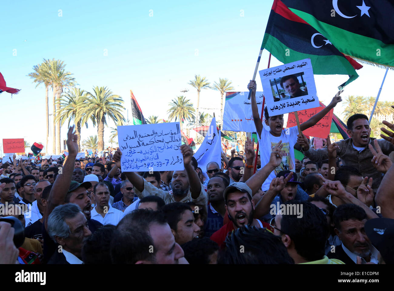 Tripoli, Libya. 30th May, 2014. Protesters wave national flags and ...