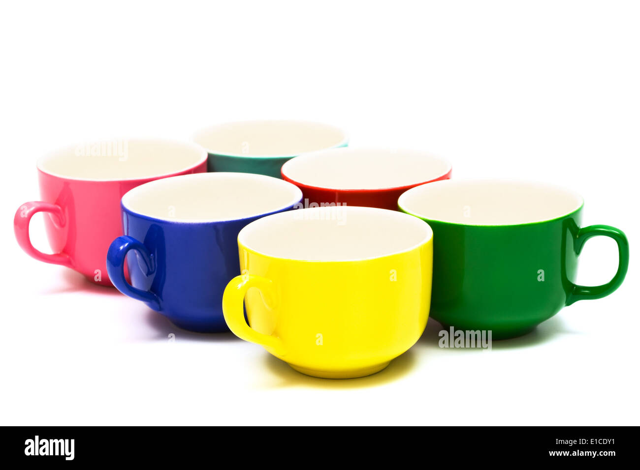 Beautiful color cups on a white background Stock Photo - Alamy