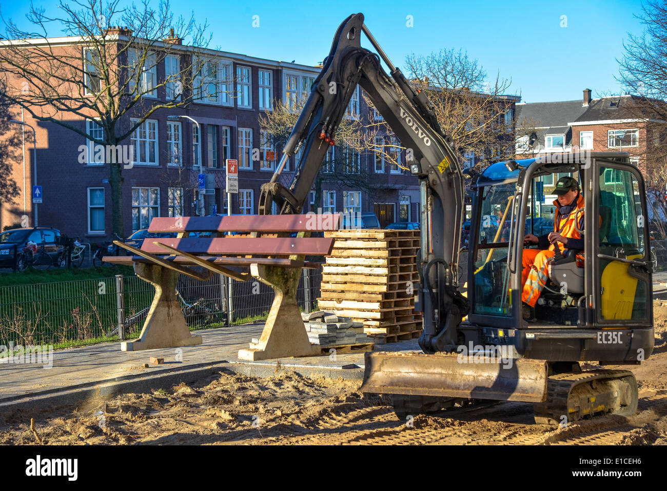 paviours at work in street in town Stock Photo - Alamy