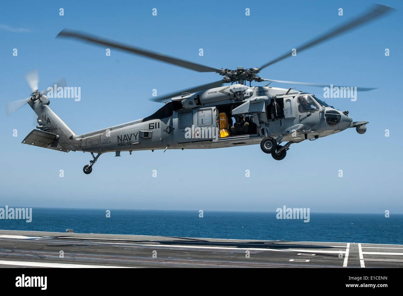 A U.S. Navy MH-60S Seahawk helicopter assigned to Helicopter Sea Combat Squadron (HSC) 15 lands ...