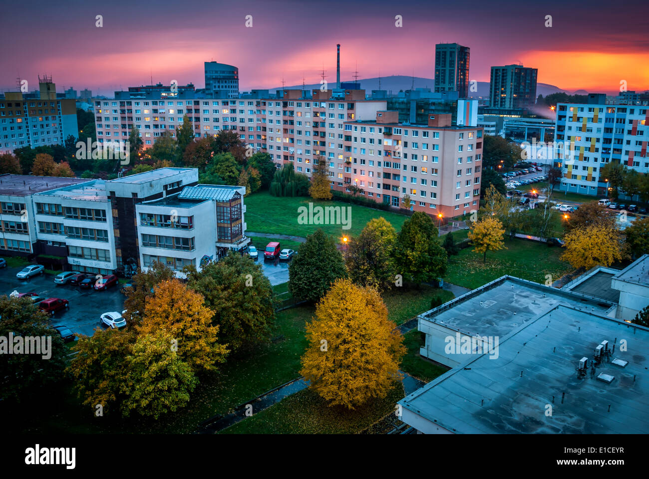 Suburb with School and Trees at Sunset Stock Photo - Alamy