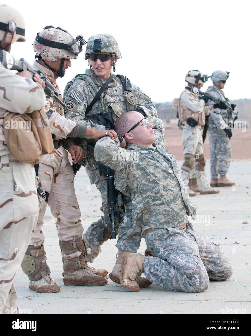 U.S. Army Spc. Patrick Cullen demonstrates to Iraqi scouts from 1st ...