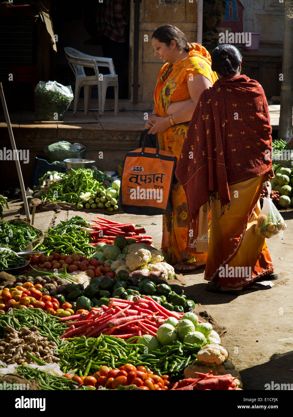 India, Rajasthan, Jaisalmer, women shopping in main vegetable bazaar ...