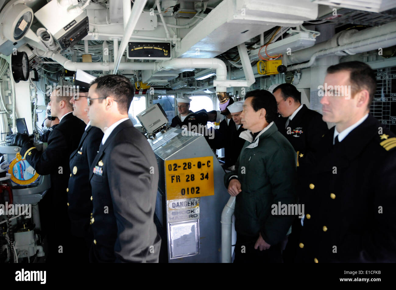 U.S. Navy Lt. Cmdr. Patrick O'Mahoney, right, the commanding officer of ...