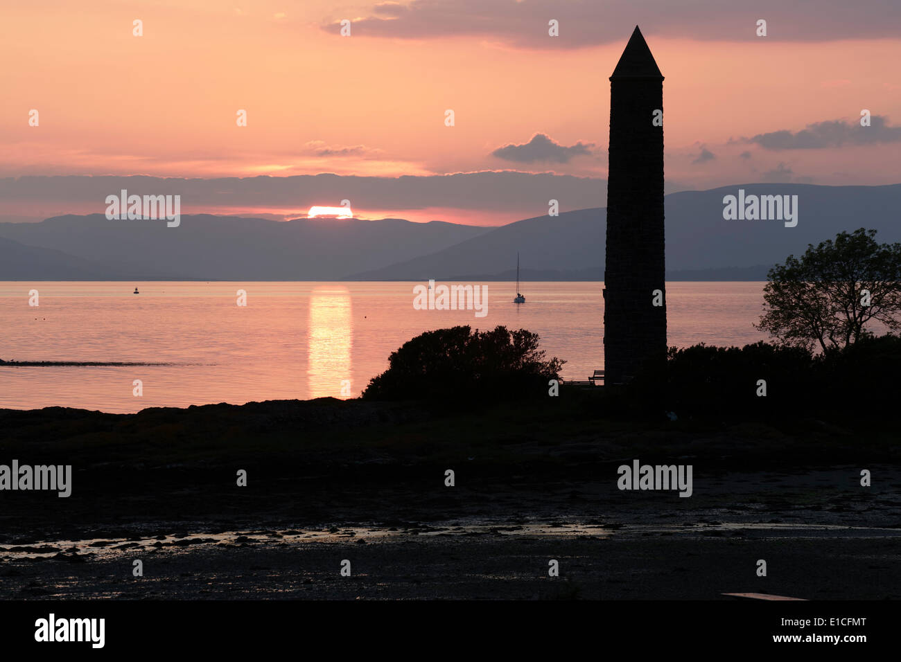 Sunset over the the Firth of Clyde and Pencil Monument in Largs ...