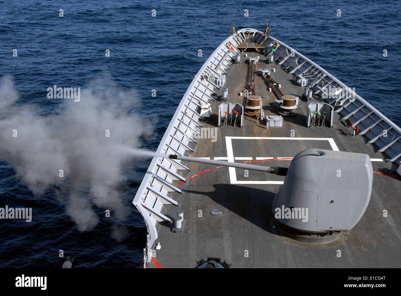 An Mk-45 five-inch .54-caliber gun is fired aboard guided-missile ...