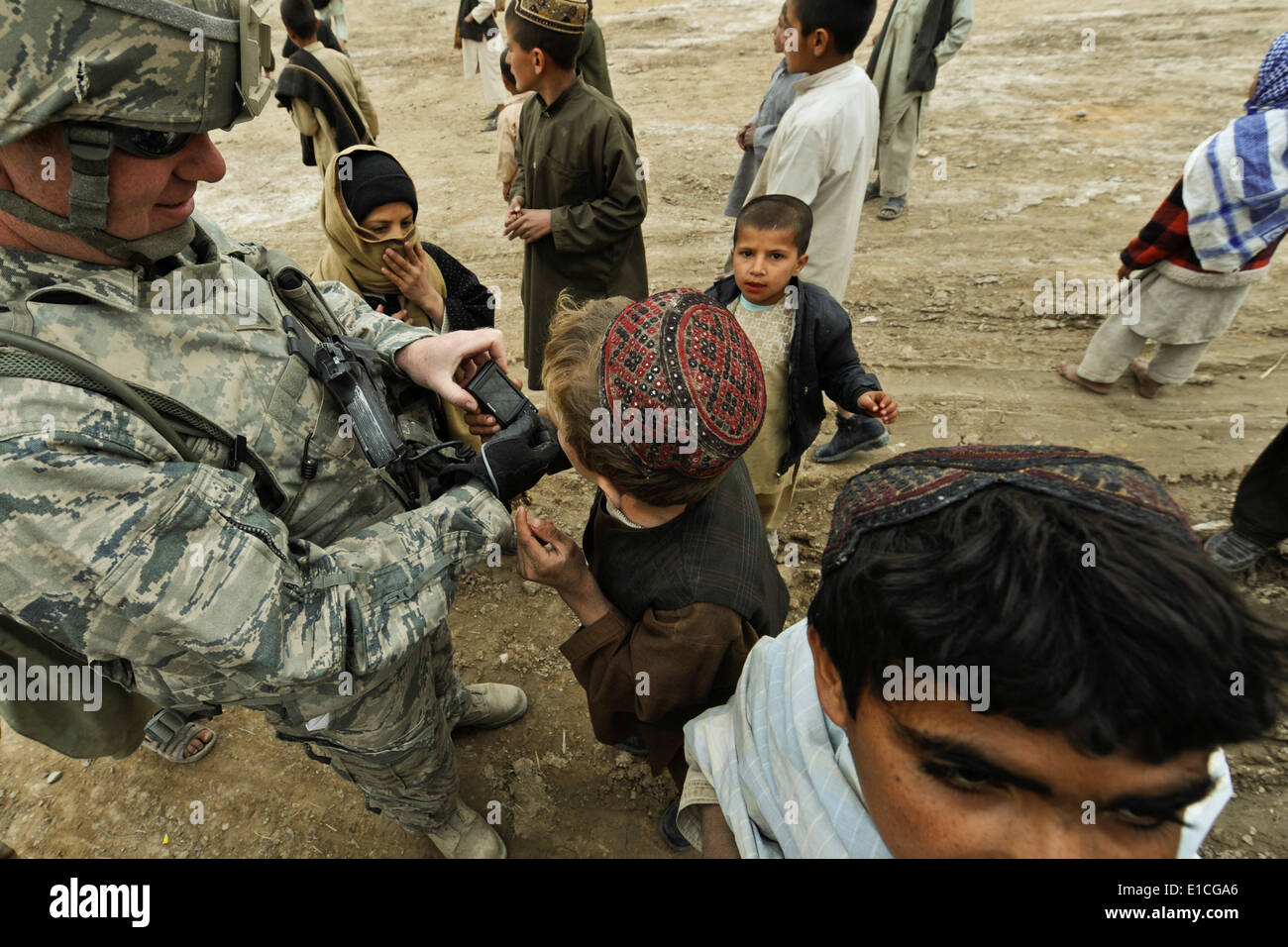 U.S. Air Force Senior Master Sgt. Keith Baxter interacts with Afghan ...