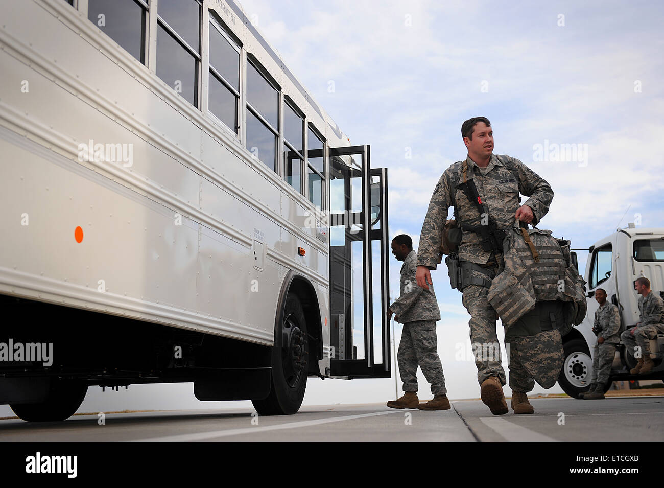 A U.S. Airman from the 823rd Security Forces Squadron (SFS) carries his gear as he walks toward ...