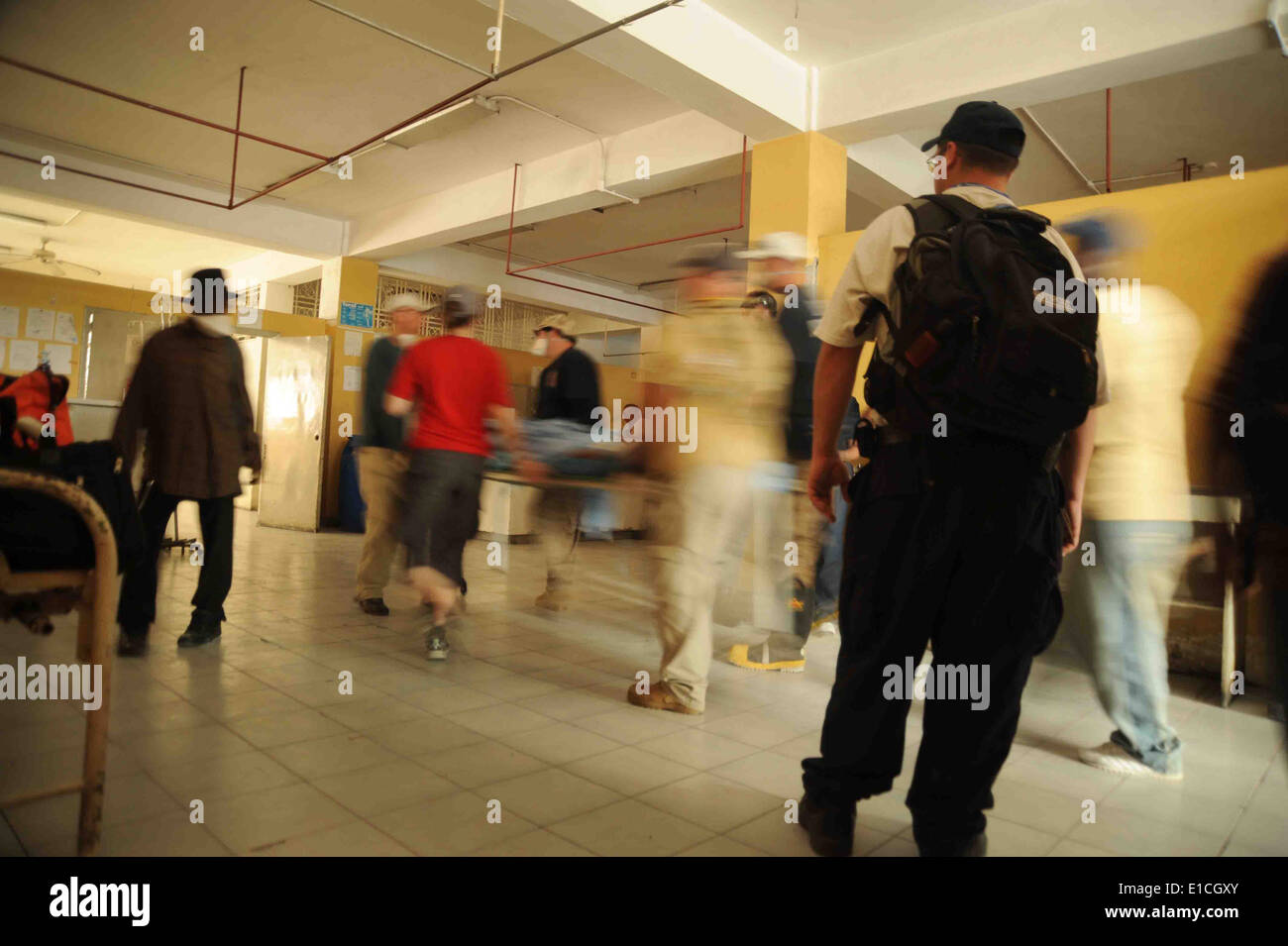 Medical personnel rush patients into the emergency room for treatment ...