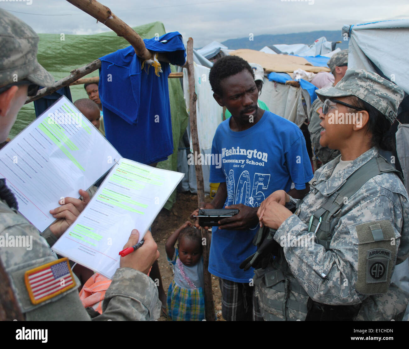 A U.S. Army medic from the 82nd Airborne Division and a civil affairs ...