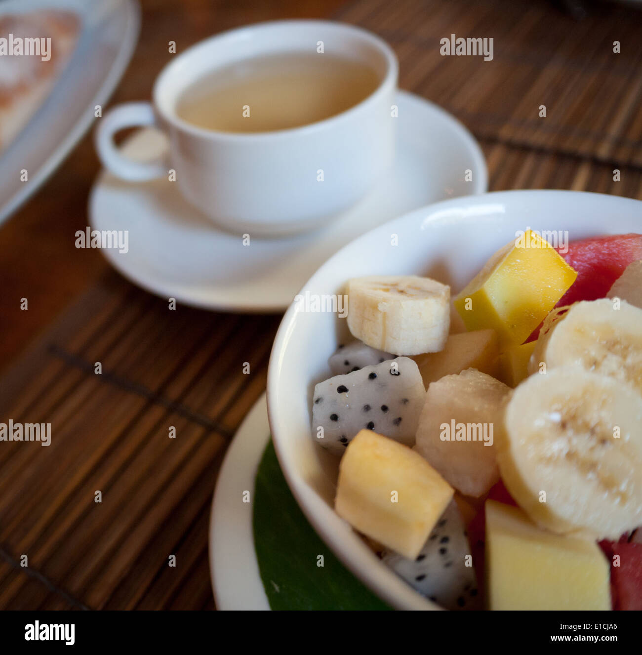Breakfast with tropical fruit salad (mango, dragonfruit, watermelon ...