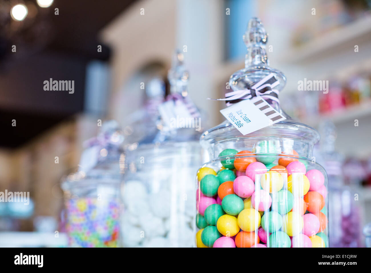 Multicolored candies on display at the candy store Stock Photo - Alamy