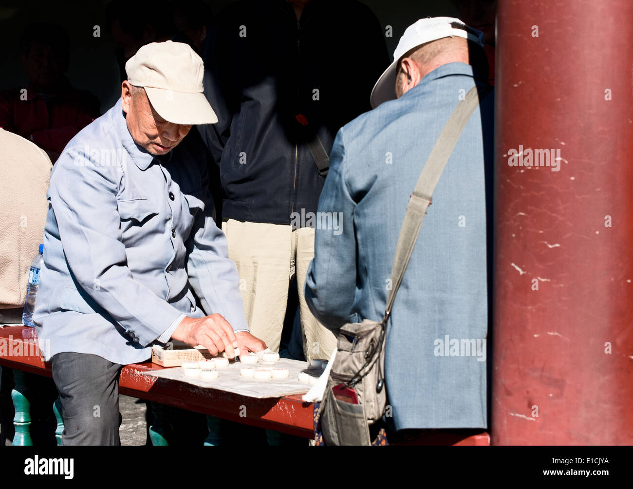 Two old man play Chinese chess in outdoor, Beijing Stock Photo - Alamy