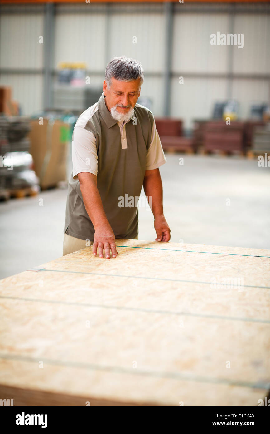 Man buying construction wood in a DIY store for his DIY home re ...