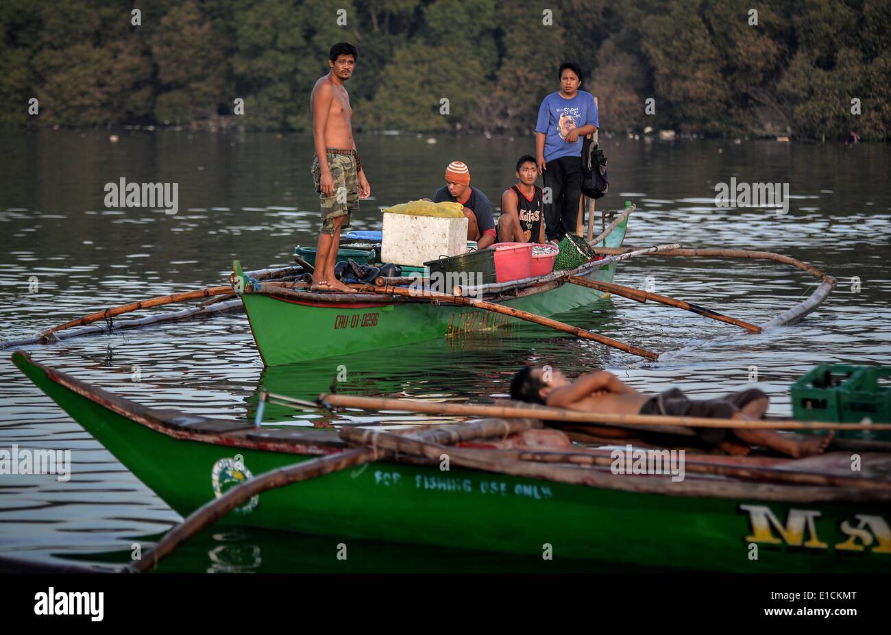 Filipino fishermen in boat in hi-res stock photography and images - Alamy