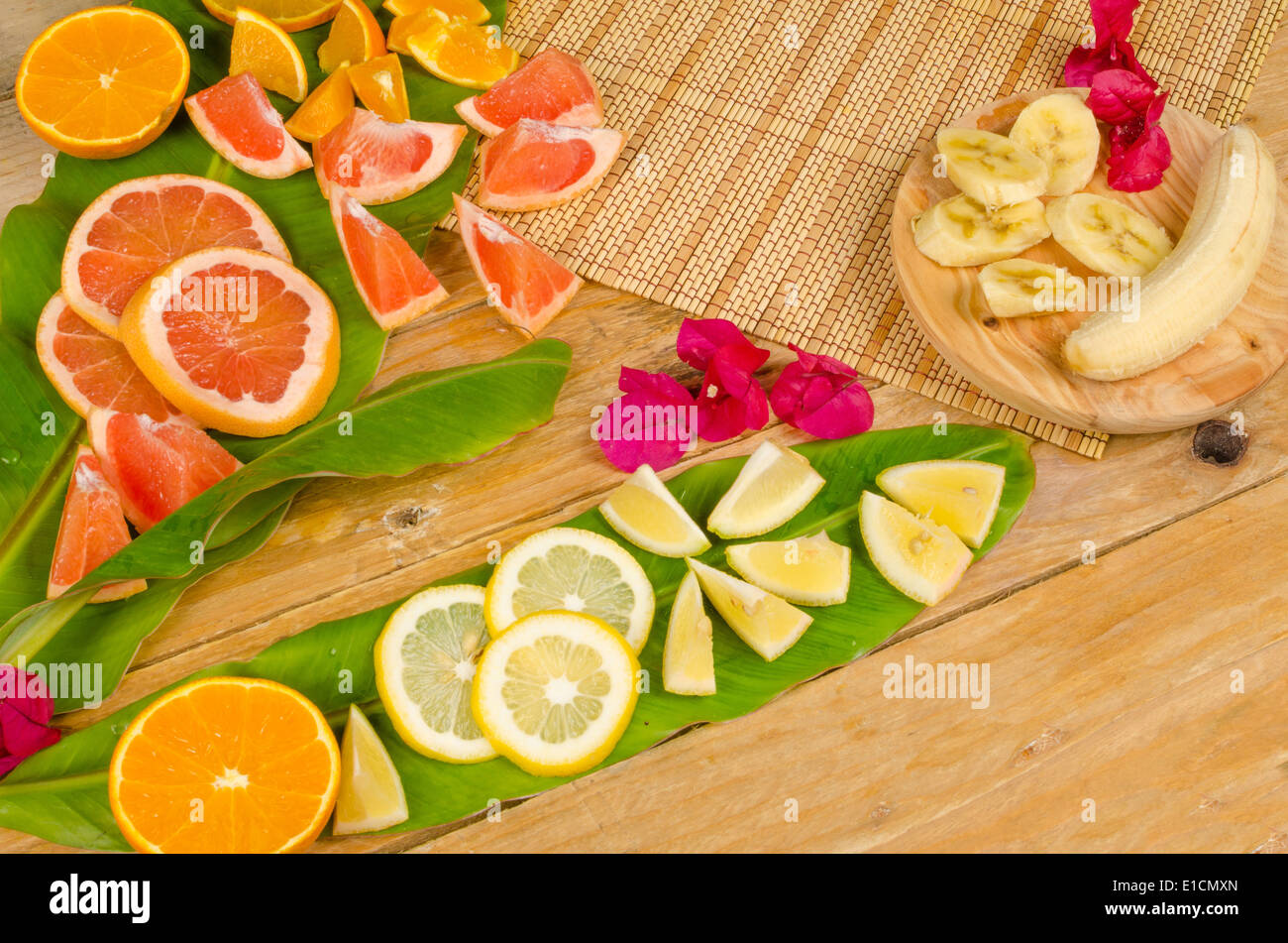 Assorted fruit on a rustic table setting Stock Photo - Alamy
