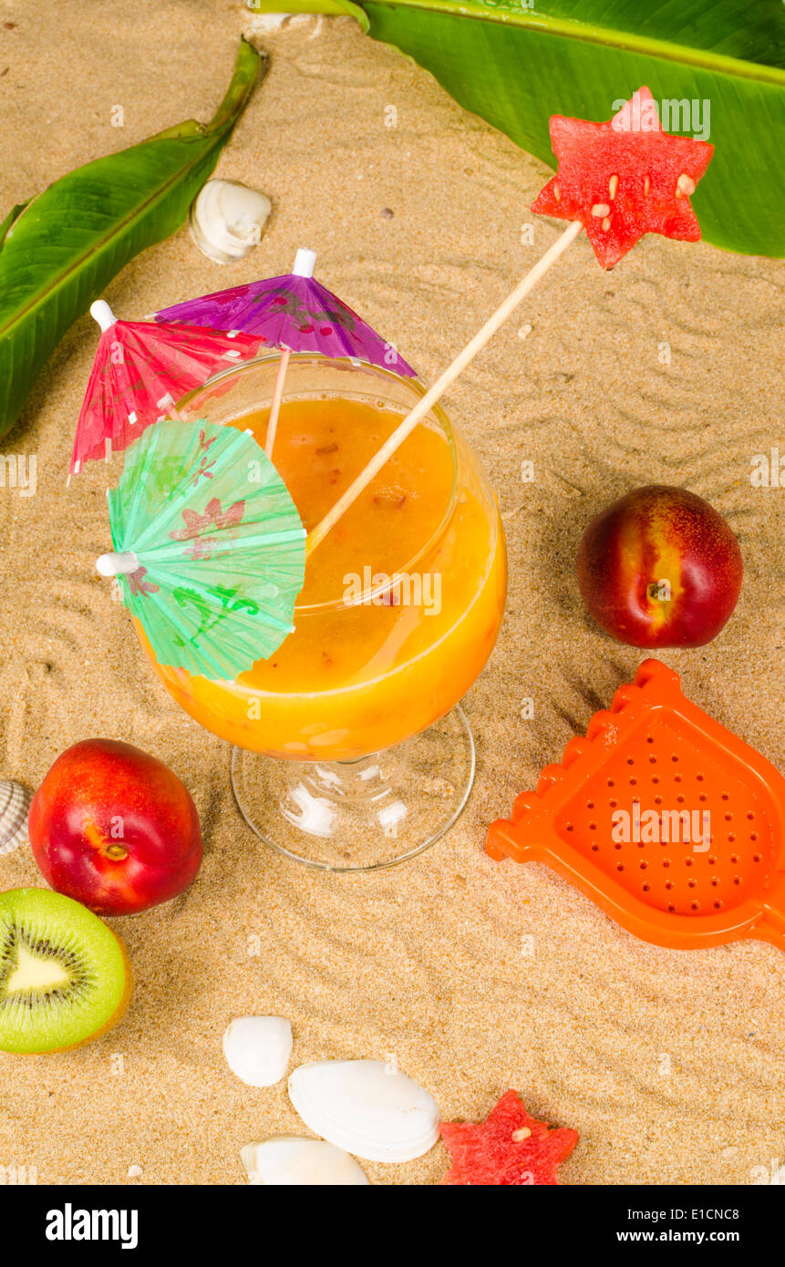 A fruity milkshake in a summertime beach setting Stock Photo - Alamy