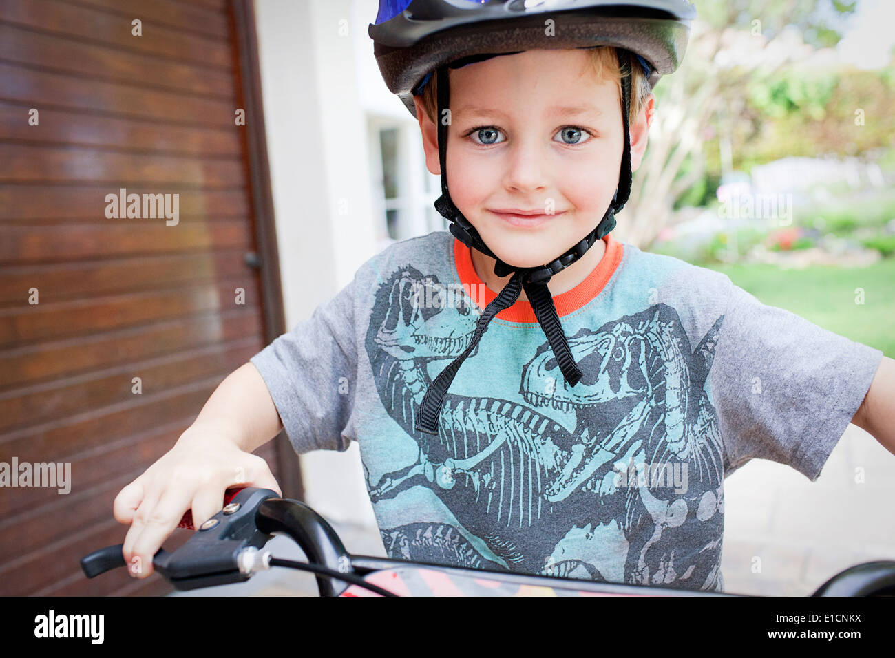 A smiling boy on his new bicycle Stock Photo - Alamy