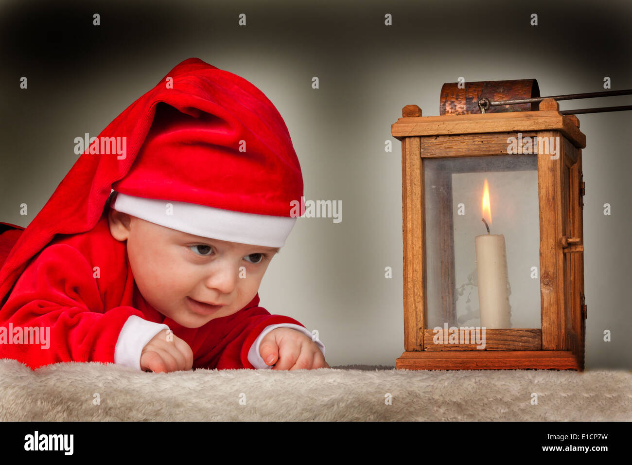 Little baby dressed as Santa Claus. Infant as Santa Claus Stock Photo ...
