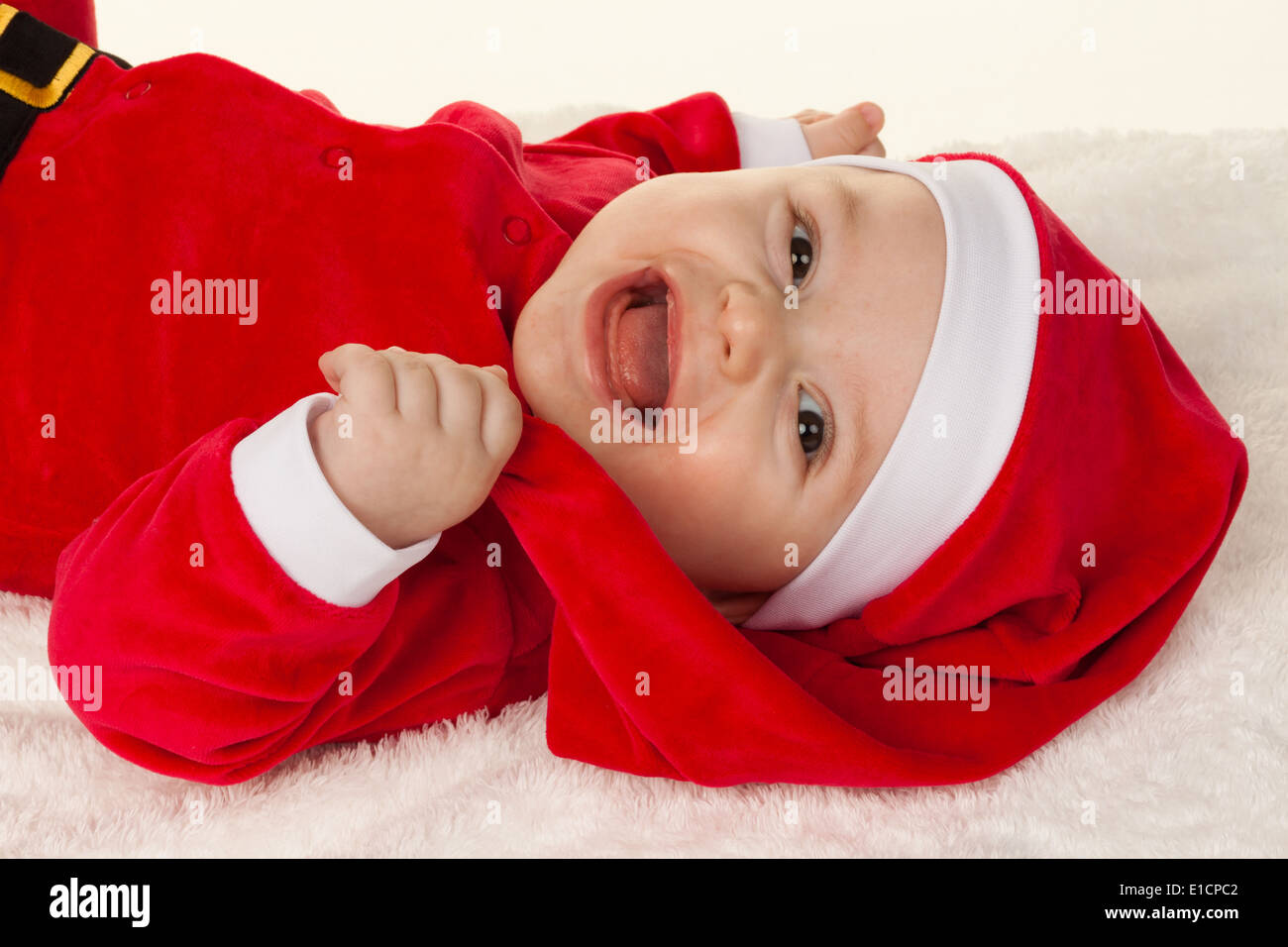 Little baby dressed as Santa Claus. Infant as Santa Claus Stock Photo ...