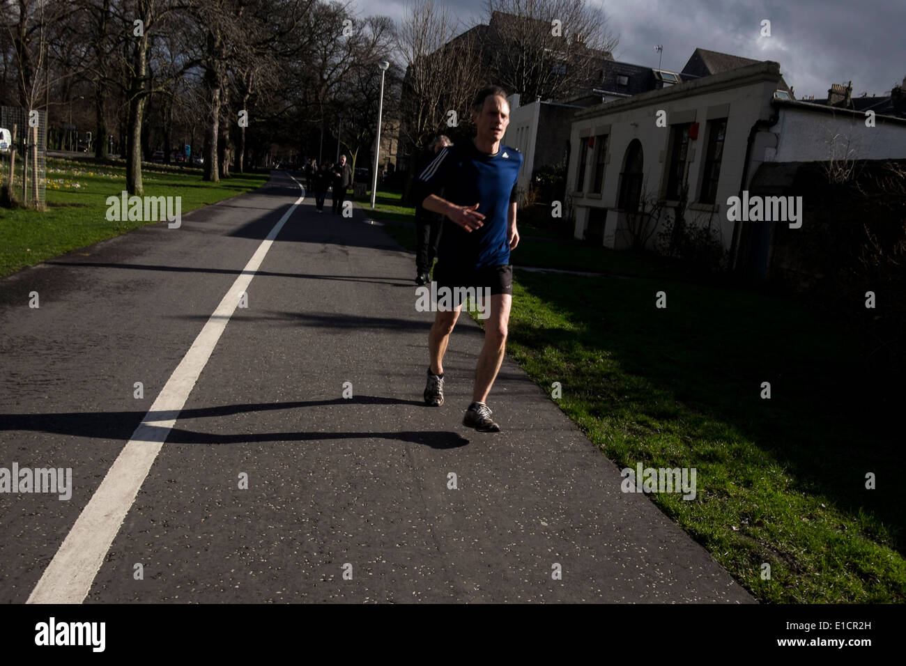 A man running in the Meadows park, Edinburgh, Scotland Stock Photo - Alamy