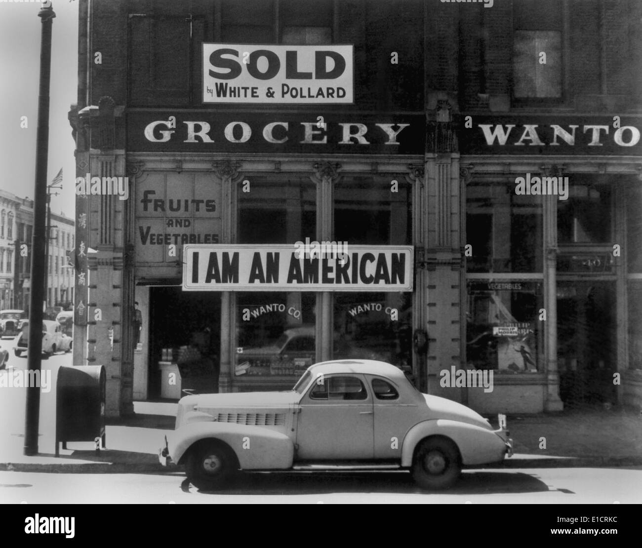 'I AM AN AMERICAN' sign on a store front. The owner, a University of ...