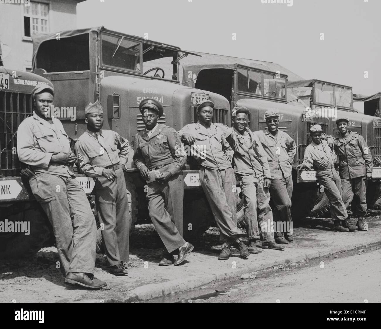 African American officers and mechanics standing in front of Army ...