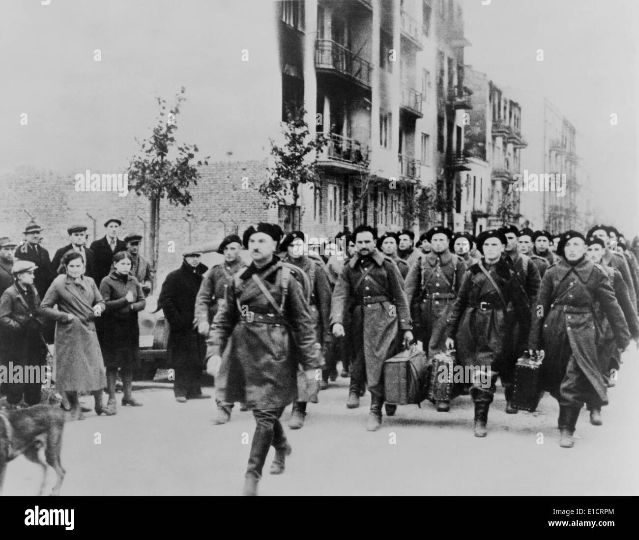 Defeated Polish soldiers march out of Warsaw to a prison camp after ...