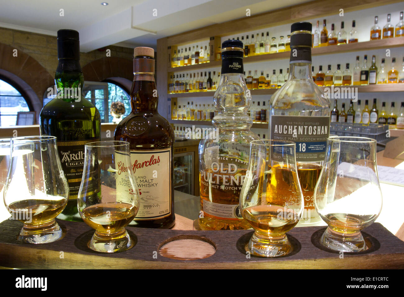 Tasting tray with a flight of whiskey at a sampling bar with multiple ...