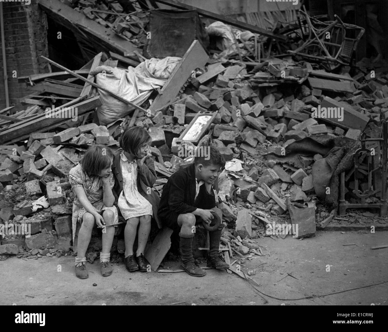 World War 2, Battle of Britain. Homeless children sit outside the ...