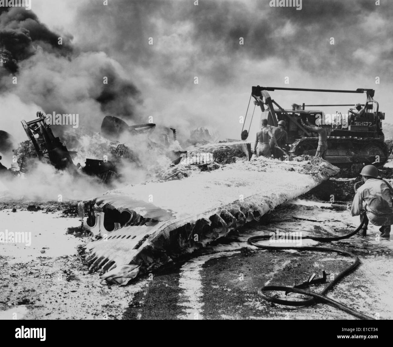Fire and destruction after a mid-day Japanese air raid on U.S. Army Air ...