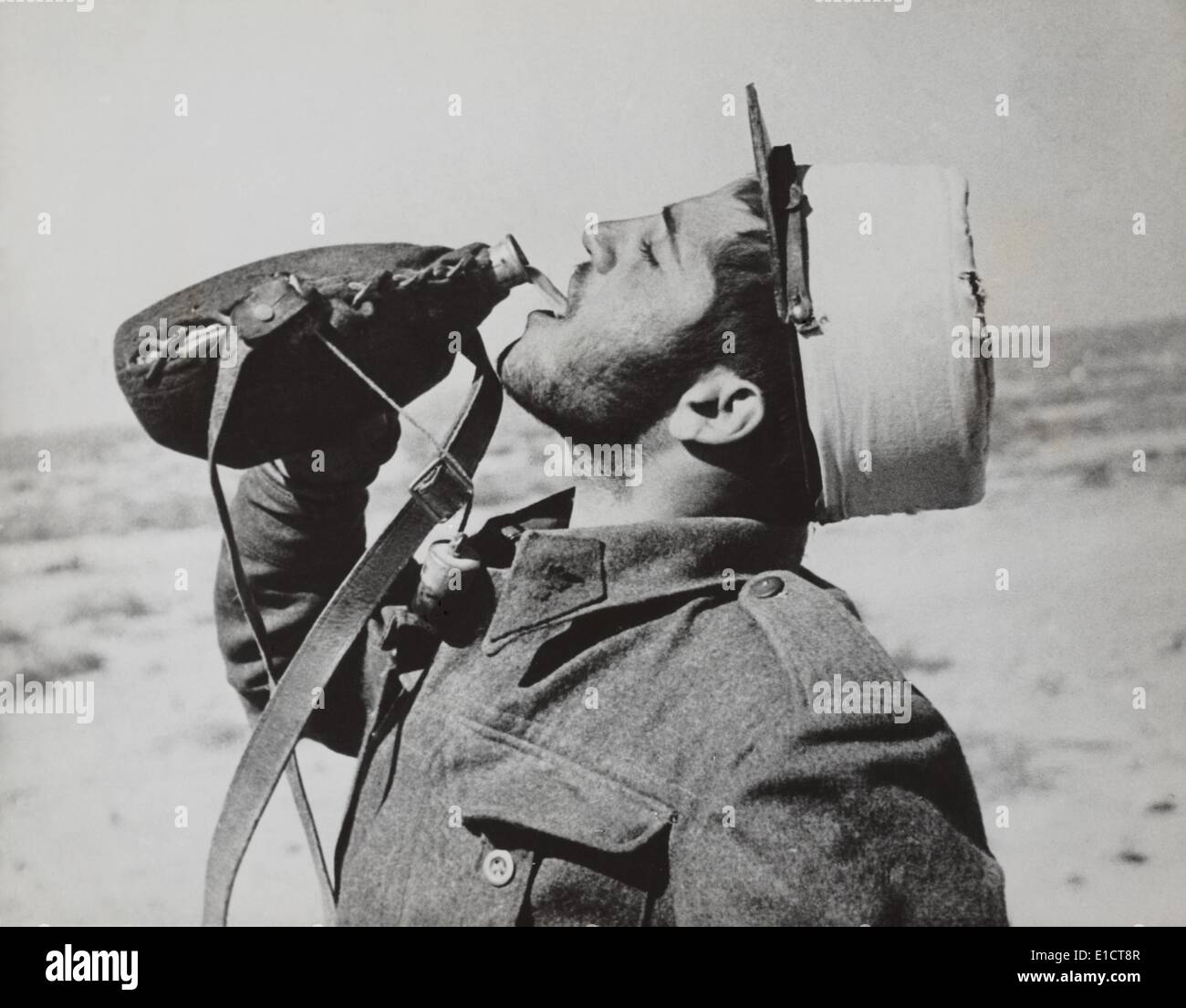 Free French soldier drinking from his canteen in the Western Desert in ...