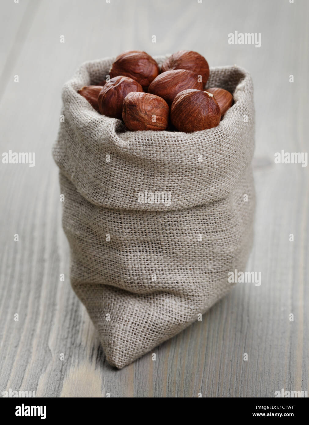 sack bag full of hazelnut kernels, rustic style photo Stock Photo - Alamy