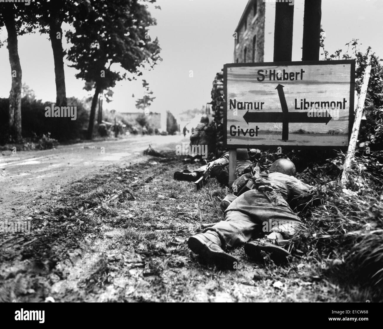 U.S. Soldiers pinned down by German small arms fire in the Belgian town ...